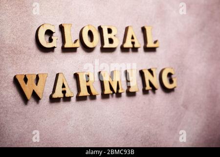 Global warming text on a colored paper Stock Photo - Alamy