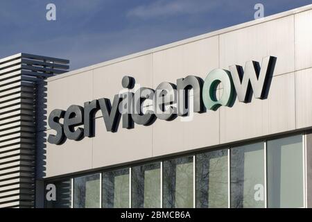 A logo sign outside of the headquarters of ServiceNow in Santa Clara ...