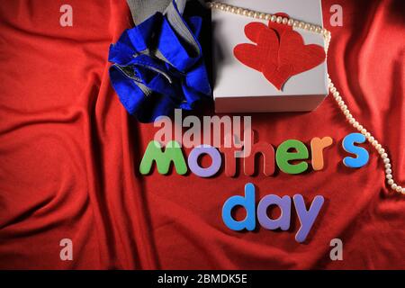 mother's day concept love mom alphabet with flower on wooden background ...
