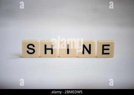 Shine in block letters Stock Photo - Alamy
