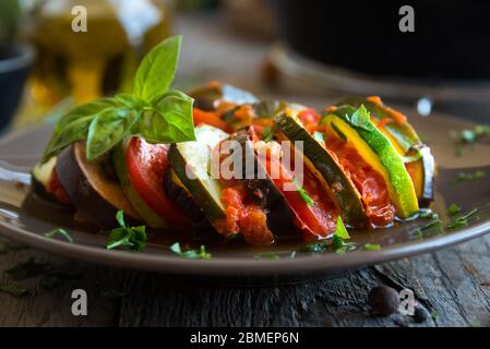 Homemade ratatouille made with sliced vegetables: zucchini, tomatoes ...