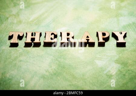Therapy word on a green paper Stock Photo - Alamy