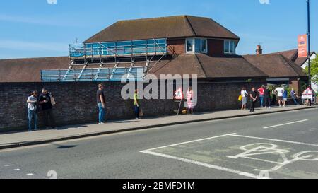 Northwood, UK. 9 May 2020. Customers queue to enter a Waitrose ...