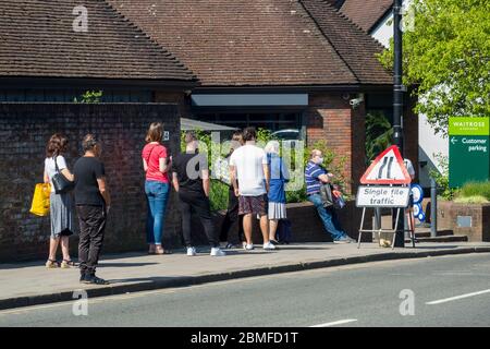 Northwood, UK. 9 May 2020. Customers queue to enter a Waitrose ...