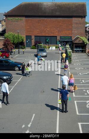 Northwood, UK. 9 May 2020. Customers queue to enter a Waitrose ...