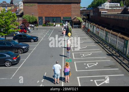 Northwood, UK. 9 May 2020. Customers queue to enter a Waitrose ...
