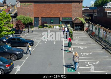 Northwood, UK. 9 May 2020. Customers queue to enter a Waitrose ...