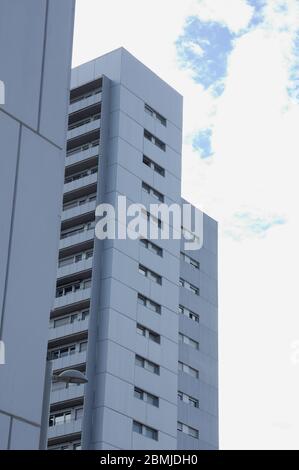 A ground perspective of some high rise buildings in the middle of a ...