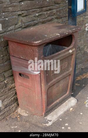 Litter bin on public road. KFC garbage bin and rubbish all around empty ...