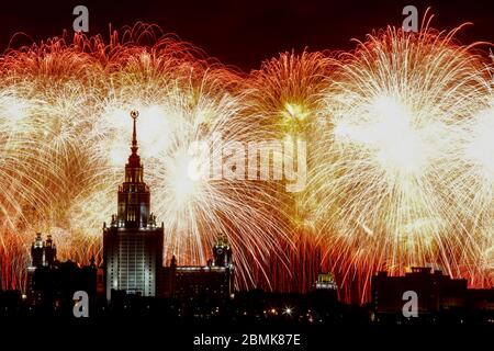 Fireworks explode behind the Moscow State University during the Victory ...