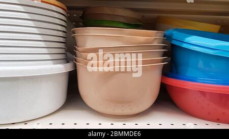 Decorative plastic storage boxes on shelves of store Stock Photo - Alamy