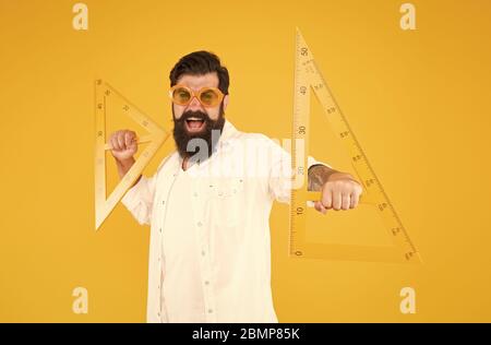 Smart student. Geometry teacher. Student using measuring instrument ...