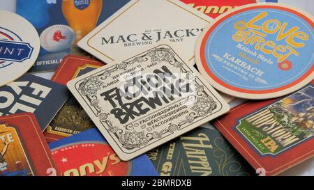 Assorted beer coasters or mats featuring American brews; Faction ...