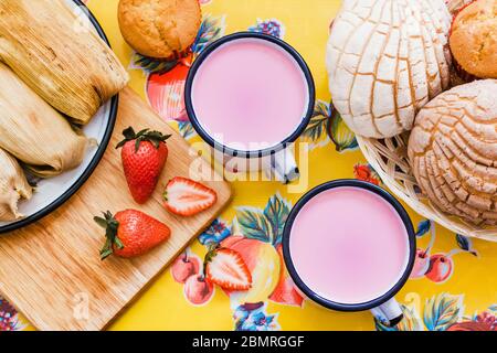 Atole de fresa, mexican traditional beverage and bread, Made with ...