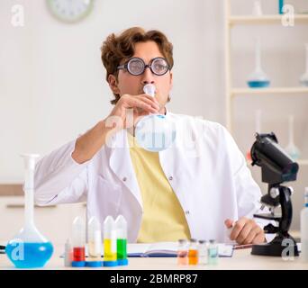 Crazy scientist smelling exploded experiment with danger chemical Stock ...
