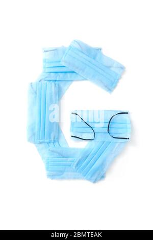 Letter O made from protective medical masks on a white background Stock ...