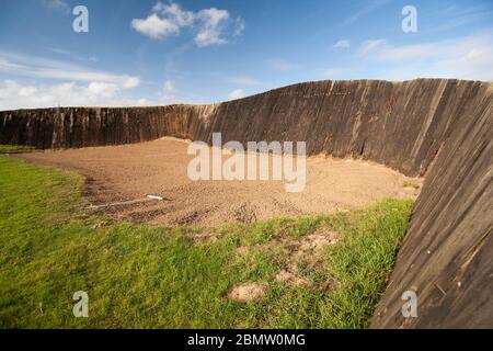 Golf course bunker with steep railway sleeper face Stock Photo - Alamy