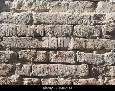 Brick grey broken masonry wall with cement white concrete damaged ...