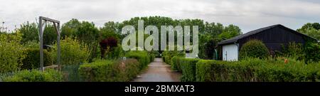 Traditional German garden allotment with a small bungalow and organic ...