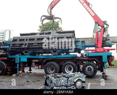 A mobile car crusher at work in Southampton where police and DVLA ...