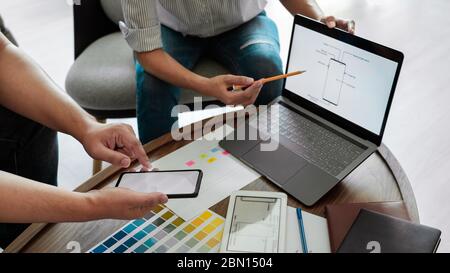 Creative team analyzing prototype products for product design in ...