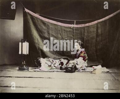 Two young women and a mosquito net. Vintage 19th century photograph ...