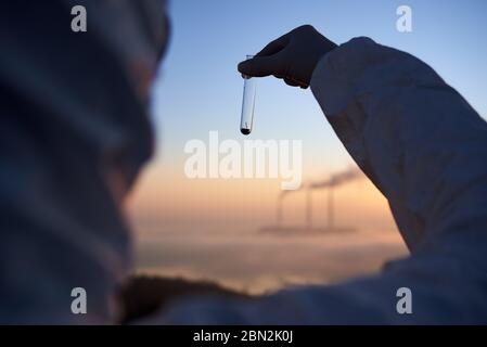 Cropped view of scientist working with glass and pipette in lab, banner ...
