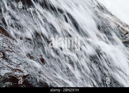 waterfall falling and hit rock splashing to river Stock Photo - Alamy