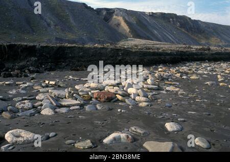 Sea erosion of coal waste on beach below disused mine Seaham Co Durham ...