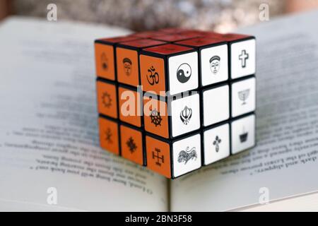Bible and Rubik's cube with religious symbols. Interreligious and ...