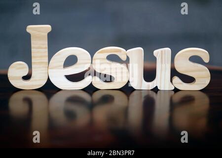 Wooden letters forming the word Jesus with Bible and heart. Christian ...
