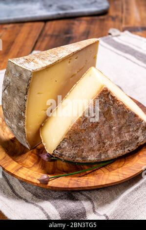 Pieces of cheese tomme de montagne or tomme de savoie made from cow ...