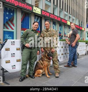 BORSTAR Agent Lora Thomas and her canine partner Twan, along with ...