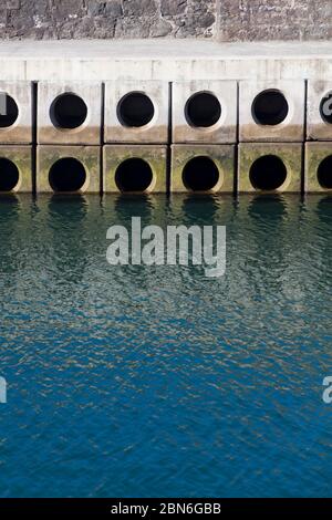 Concrete blocks on the quayside at Funchal harbour on Madeira Island ...