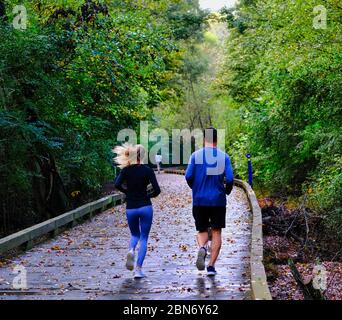 Couple jogging on a hike Stock Photo - Alamy