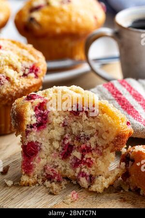 Half cut cranberry berry and fresh cranberries in wooden spoon isolated ...