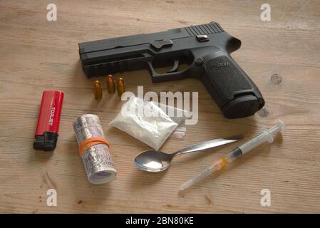 Drugs paraphernalia with a Sig Sauer P250 automatic pistol Stock Photo ...