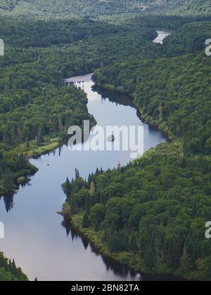 View at the Jacques Cartier lake in Quebec with reflects in the clear ...