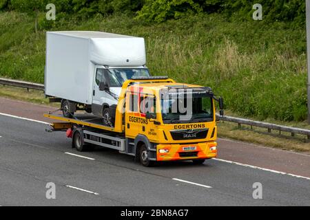 Heavy hgv Scania breakdown rescue tow truck moving a white Veolia ...