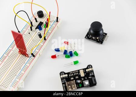 Microcontrollers, chips, resistors and light-emitting diodes on white ...