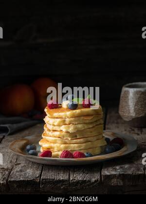 Pancake with butter. Side view, copy space, vertical. Dark moody old ...