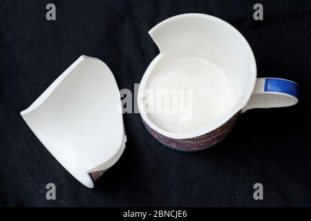 Close-up of a cup with broken handle Stock Photo - Alamy
