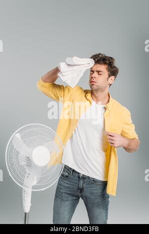 Man with towel suffering from heat stroke outdoors Stock Photo - Alamy
