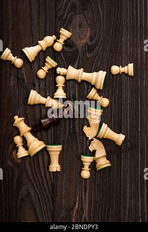 King among pawns on wooden chess board against white background Stock ...