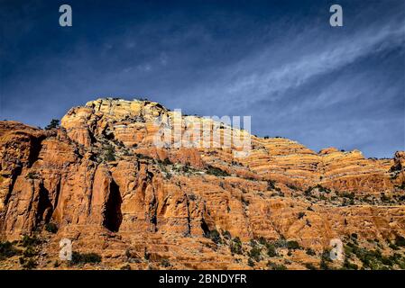 Beautiful picture of orange rocky hills and foliage trees under the ...