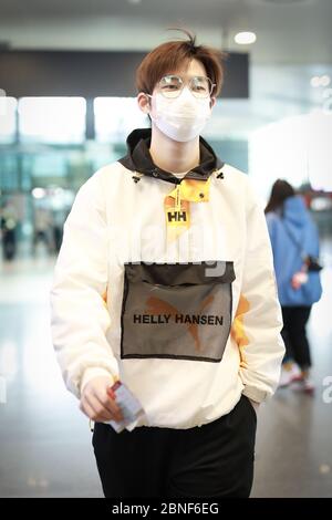 Chinese singer and actor Dong Li arrives at a Shanghai airport before ...