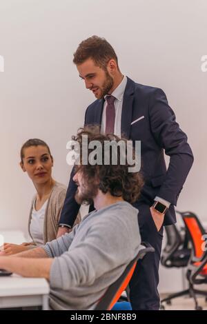 Manager overseeing his employees beautiful blonde and a coworker with ...