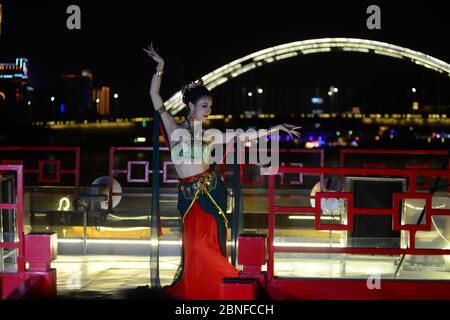 A performer plays Dunhuang Flying Apsaras Dance, which drew inspiration ...