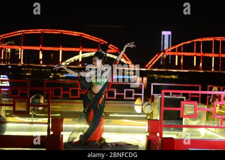 A performer plays Dunhuang Flying Apsaras Dance, which drew inspiration ...