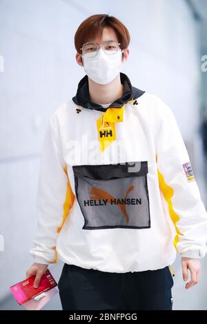 Chinese singer and actor Dong Li arrives at a Shanghai airport before ...